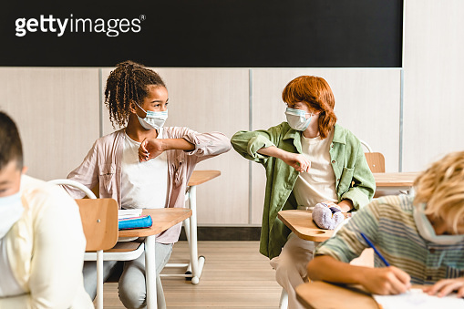 Schoolgirls classmates pupils students protecting against coronavirus ...