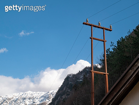 Small electricity pylon. Rural transmission tower. Power line. Electric ...