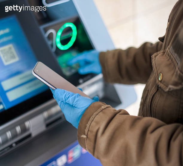 Withdrawing non-contact money using mobile phone with qr code, hygiene ...