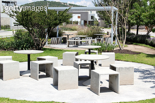 Outdoor community area with benches, tables and games for neighborhood ...