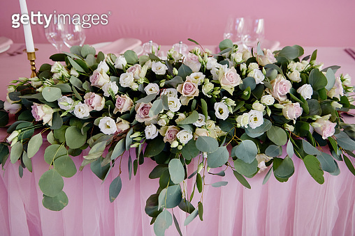 Lush floral arrangement on wedding table. Wedding presidium in ...