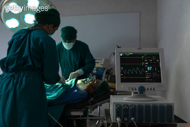 Surgeons team doctor operating and working with Monitoring of patient ...