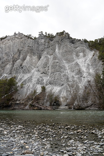 Rocky walls and Anterior Rhine river of the Ruinaulta ravine or gorge ...