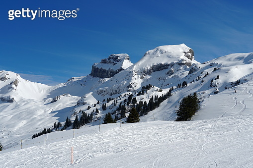 Rocks and rocky peaks surrounding the skiing slopes in the alpine ...