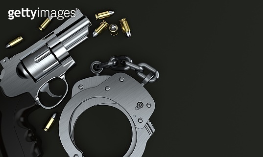 Handcuffs with gun and ammunition 이미지 (1339599371) - 게티이미지뱅크