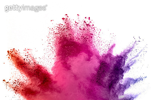 Abstract multicolored powder splash on white background.Freeze motion ...