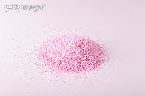 Pink dried strawberries or beetroots powder on white background ...