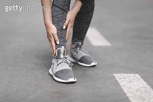Shin Splints. Female Jogger suffering from sport trauma while running ...