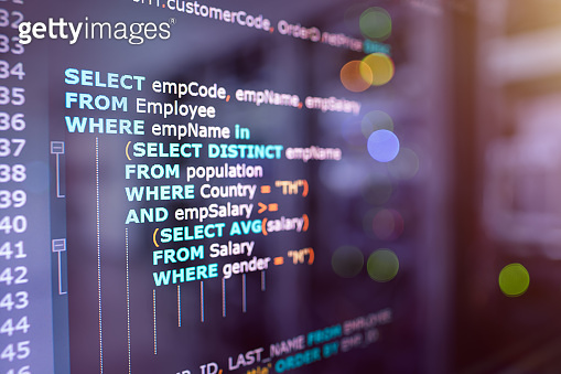 Sql Structured Query Language Code On Computer Monitor And Server