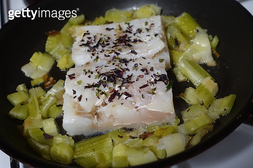 Deep-fried frozen cod with leeks and celery in portions seasoned with ...