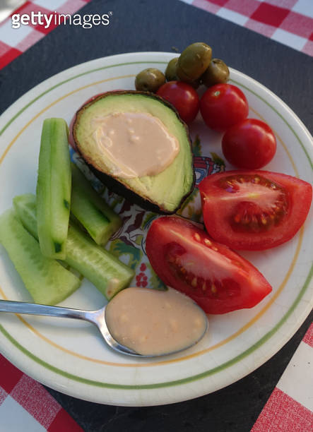 Mature avocado with lemon ketchup mayonnaise sauce Cucumber and ...