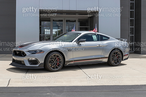 Ford Mustang display at a dealership. Mustangs can be ordered in a base ...