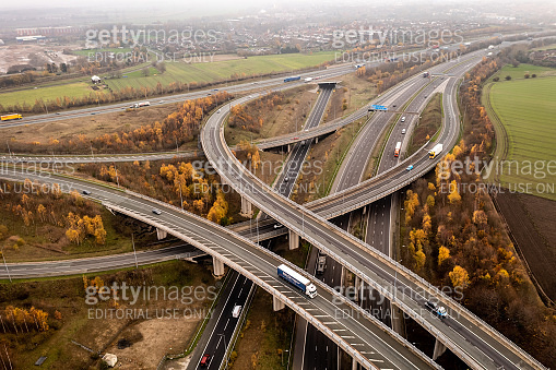 Aerial view of a complex motorway road layout in the UK countryside ...