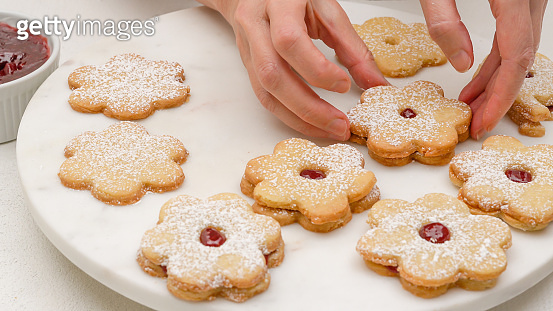 Flower shaped shortbread cookies filled with raspberry jam recipe ...