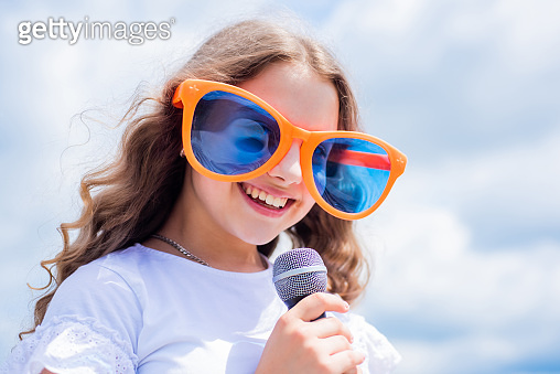 cheerful child singer singing in microphone music style, vocal ...