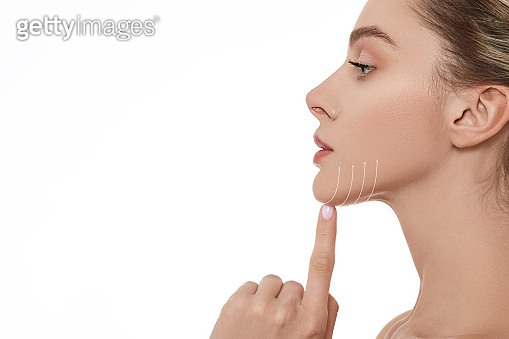 Beautiful woman with perfect skin with lifting arrows on chin line ...
