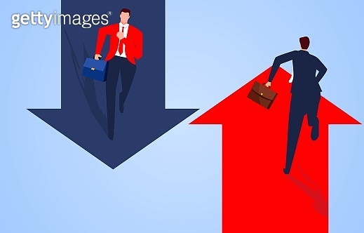 Businessman running hard on two arrows in different directions ...