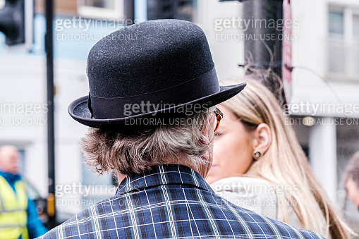 Man Wearing Traditional Black Bowler Hat And funky Bright Jacket ...