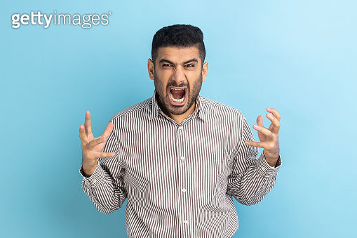 Angry businessman looking at camera, having aggressive facial ...