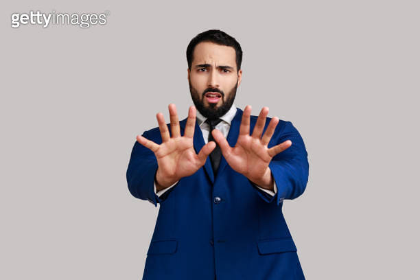 Man raising hands from sudden fear, looking terrified, scared to death ...