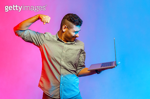 Man punching laptop screen, boxing threatening to hit while having ...