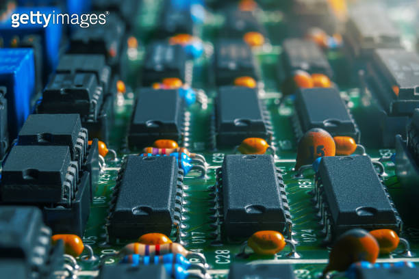 Closeup of Printed Circuit Board with integrated circuits and many ...