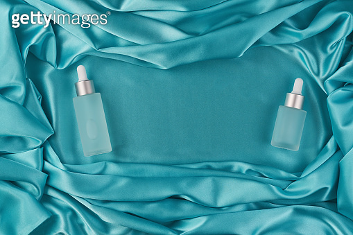 glass vial with professional facial serum on abstract background luxury ...