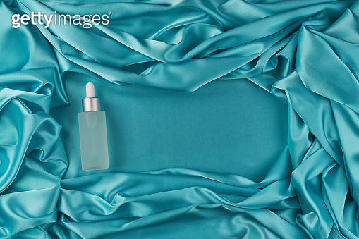 glass vial with professional facial serum on abstract background luxury ...