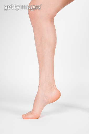 Barefoot and legs isolated on white background. Closeup shot of healthy ...