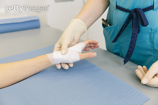 A doctor wrapped around the wrist for first aid close-up. Application ...