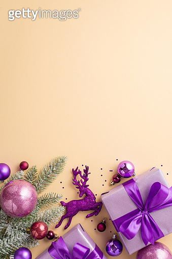 Christmas concept. Top view vertical photo of lilac present boxes with ...