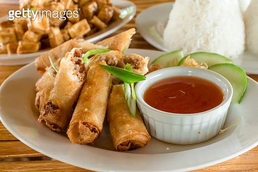 Lumpiang Shanghai, a Filipino egg roll, with Sizzling tofu and a cup of ...