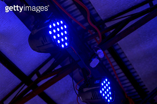 2 PAR lights installed on the ceiling of a bar or nightclub. Also known ...