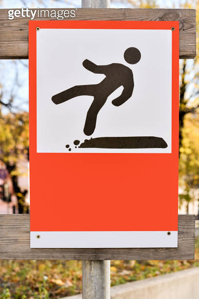 Road sign warns pedestrians about falling. Warning sign with falling ...