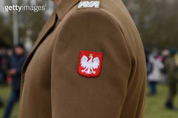 The emblem of Poland on the uniform of a soldier of the Polish army ...