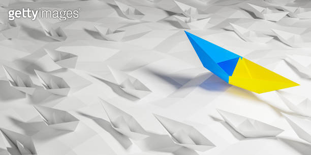 Help for Ukraine concept. Lone paper ship with Ukrainian flag sailing ...