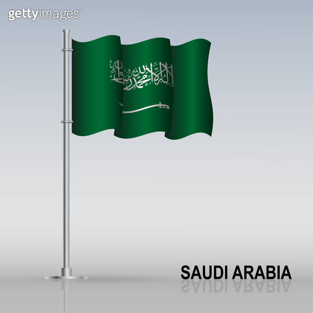 Flag of Saudi Arabia flying on a flagpole stands on the table ...