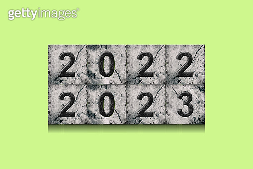 2022, 2023, numbers on stone blocks, on a bright green background. New ...