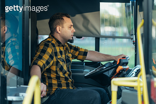 Bus driver behind the wheel of a public transport vehicle 이미지 ...