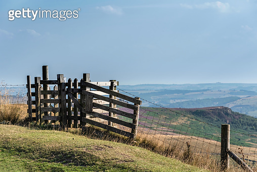 Landscape image looking through stile into Peak District countryside in ...