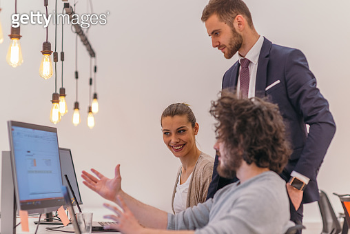 Manager overseeing his employees beautiful blonde and a coworker with ...