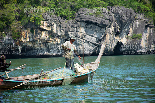 Thai man fisher people sailing wood long tail boat fishery floating in ...