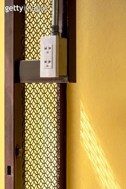 Side view of electrical power socket and conduit pipe line on edge of ...