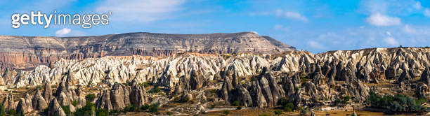 Panoramic view of multi-layered multi-colored hills in Goreme, Turkey ...