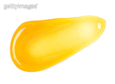 Yellow transparent gel sugar honey smear smudge with bubbles macro ...