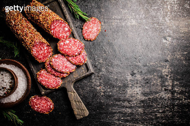 Sliced salami sausage on a cutting board with spices. 이미지 (1375697956 ...