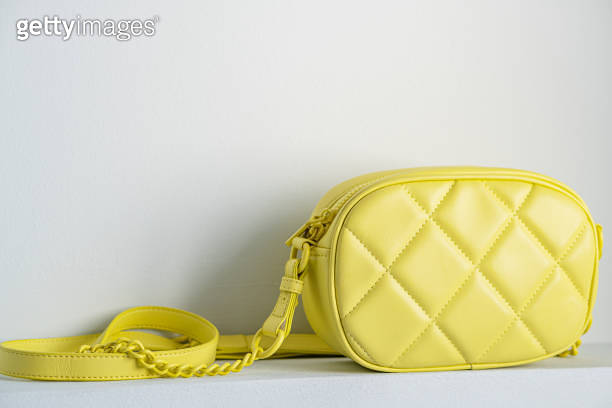 Lime cross body bag. Ladies bright-colored handbag on gray background ...