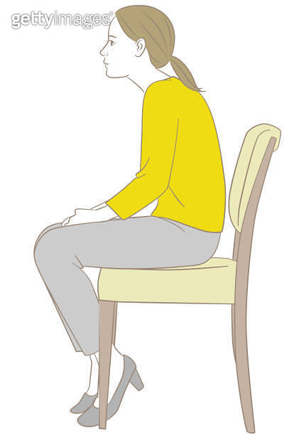 A woman sitting in a chair with a stooped posture (1436422718) - 게티이미지뱅크