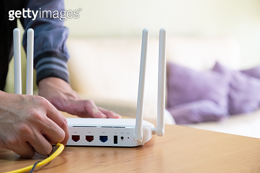 Selective focus at router. Internet router on working table while ...