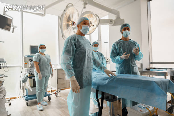 Team of surgeons in the operating room ready for surgery in clinic ...
